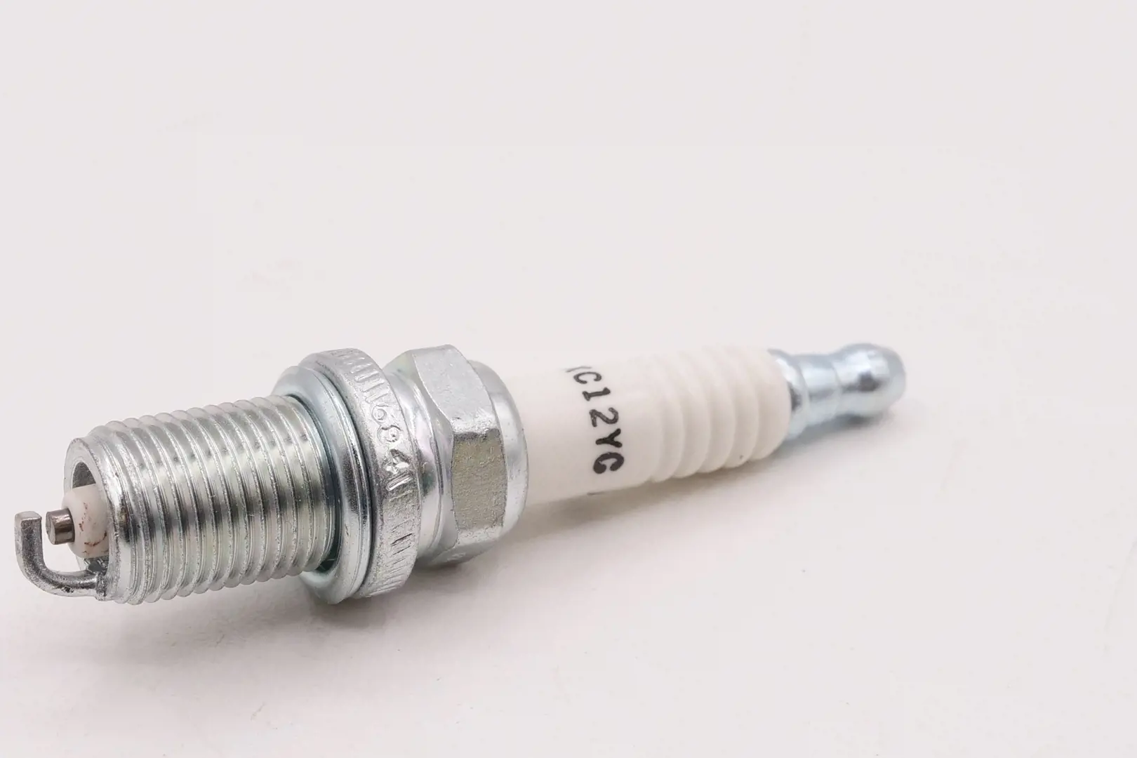 Kubota #E7187-52140 PLUG, SPARK RFI